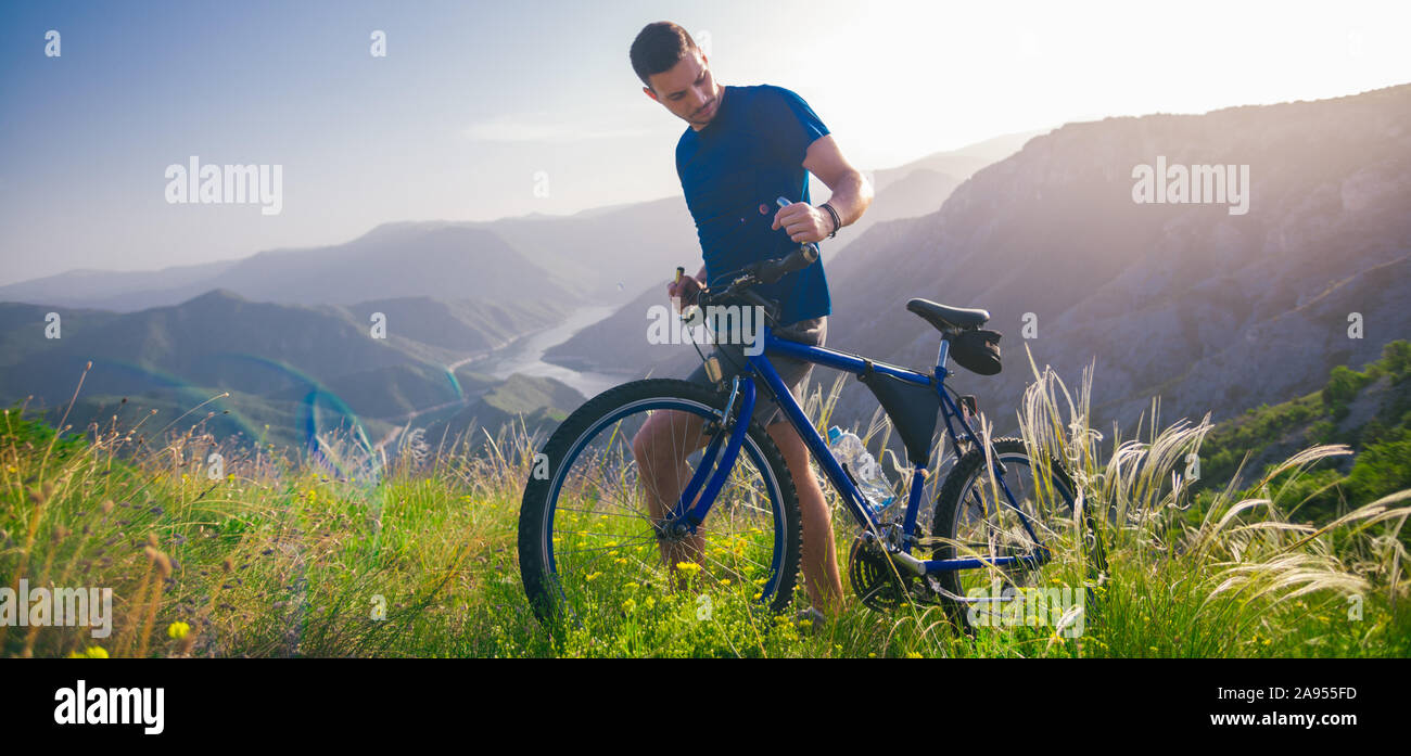 Downhill rider pushing bike hi-res stock photography and images - Alamy