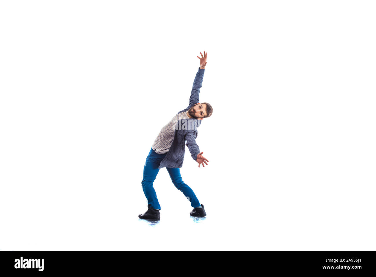 Young man showing dance moves on white background Stock Photo - Alamy
