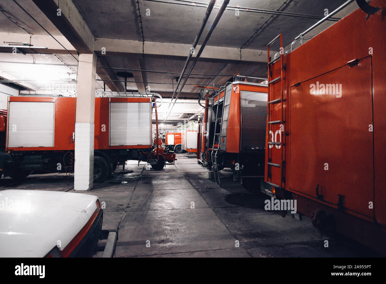 Garage with trucks equipped with deluge guns for fire emergency ...