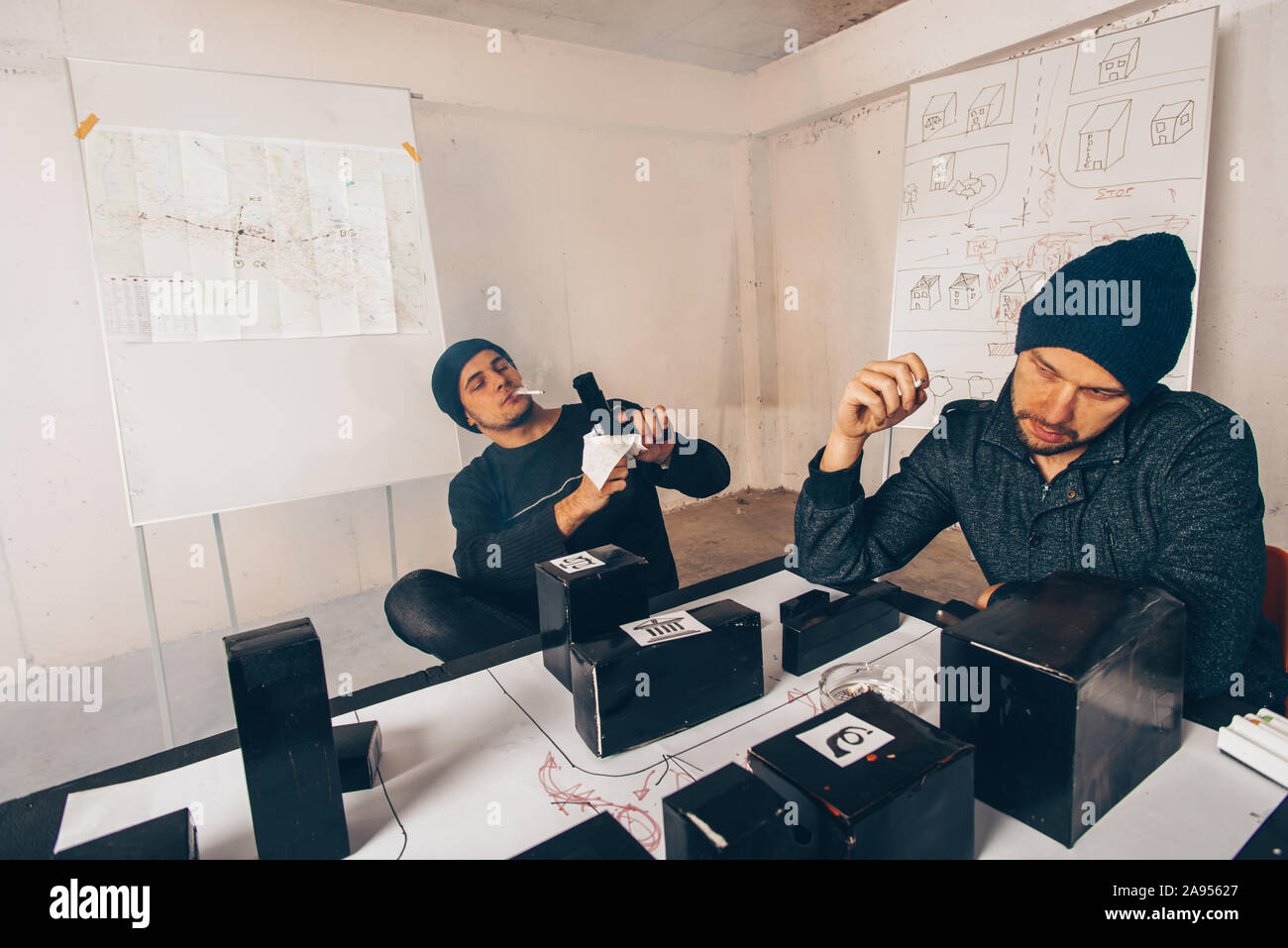 Two young people are sitting in a room, they are talking and planing a ...