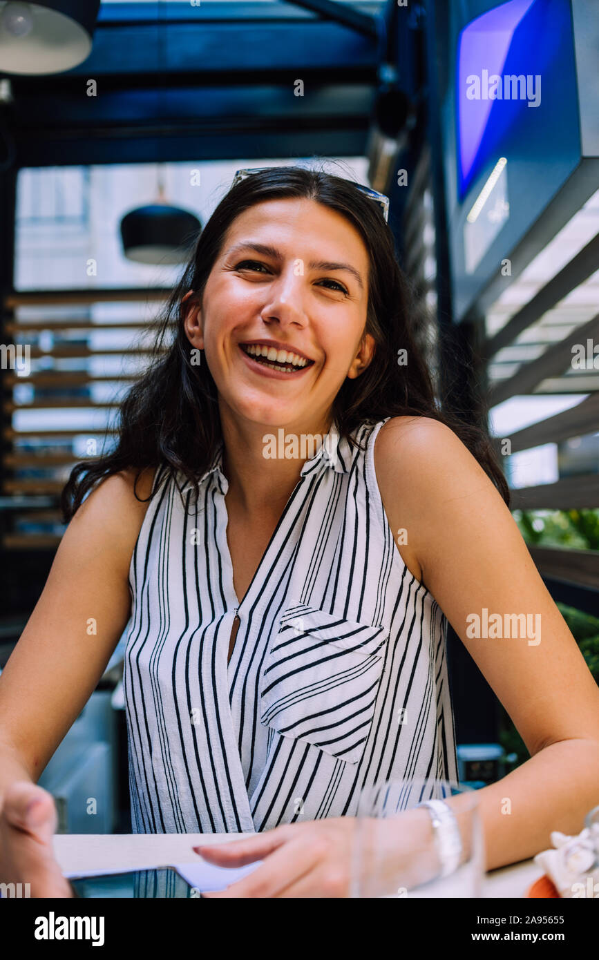 Young woman sitting busy bar restaurant hi-res stock photography and ...