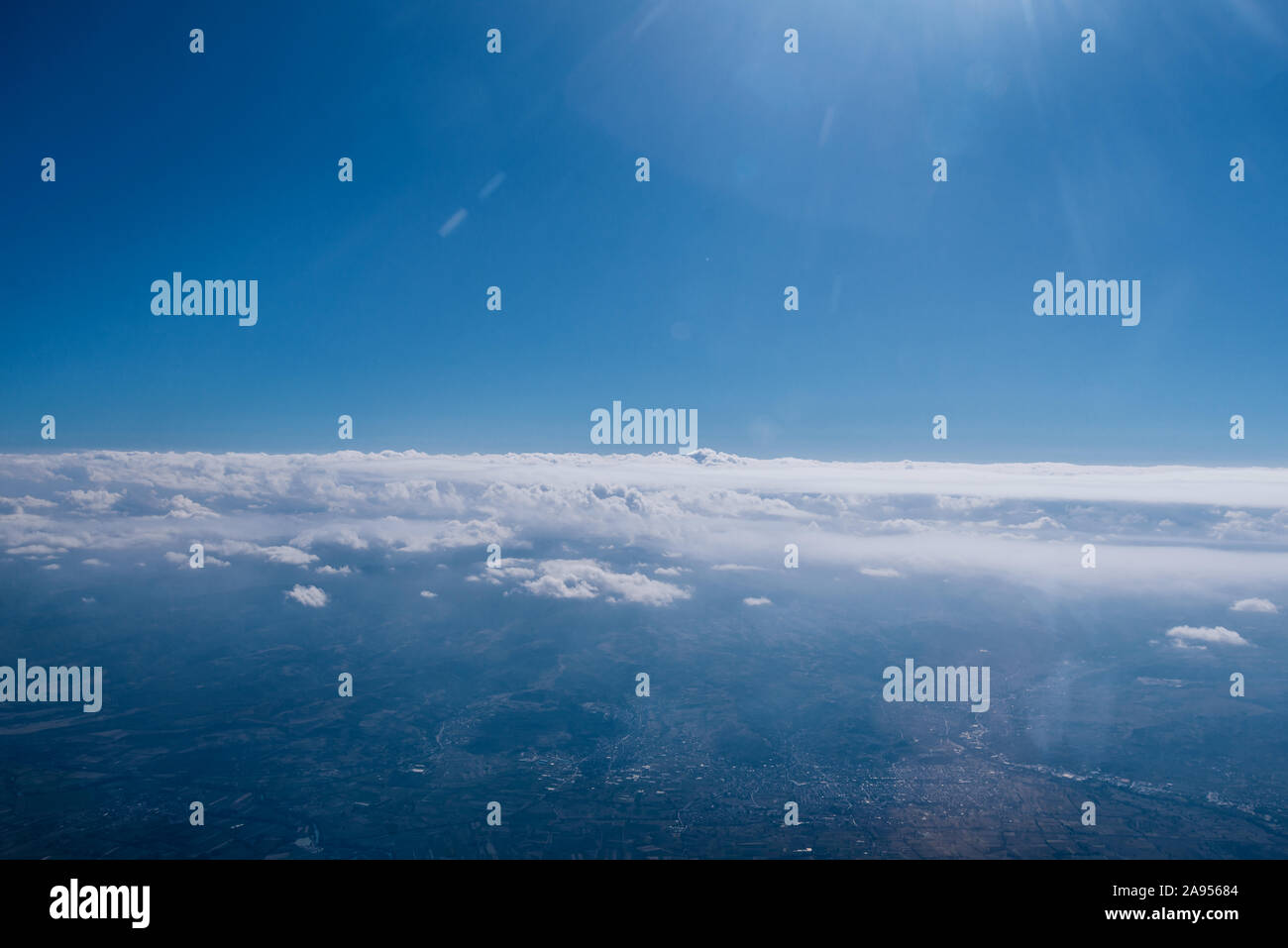 Magnificent view from above the clouds through an airplane window Stock ...
