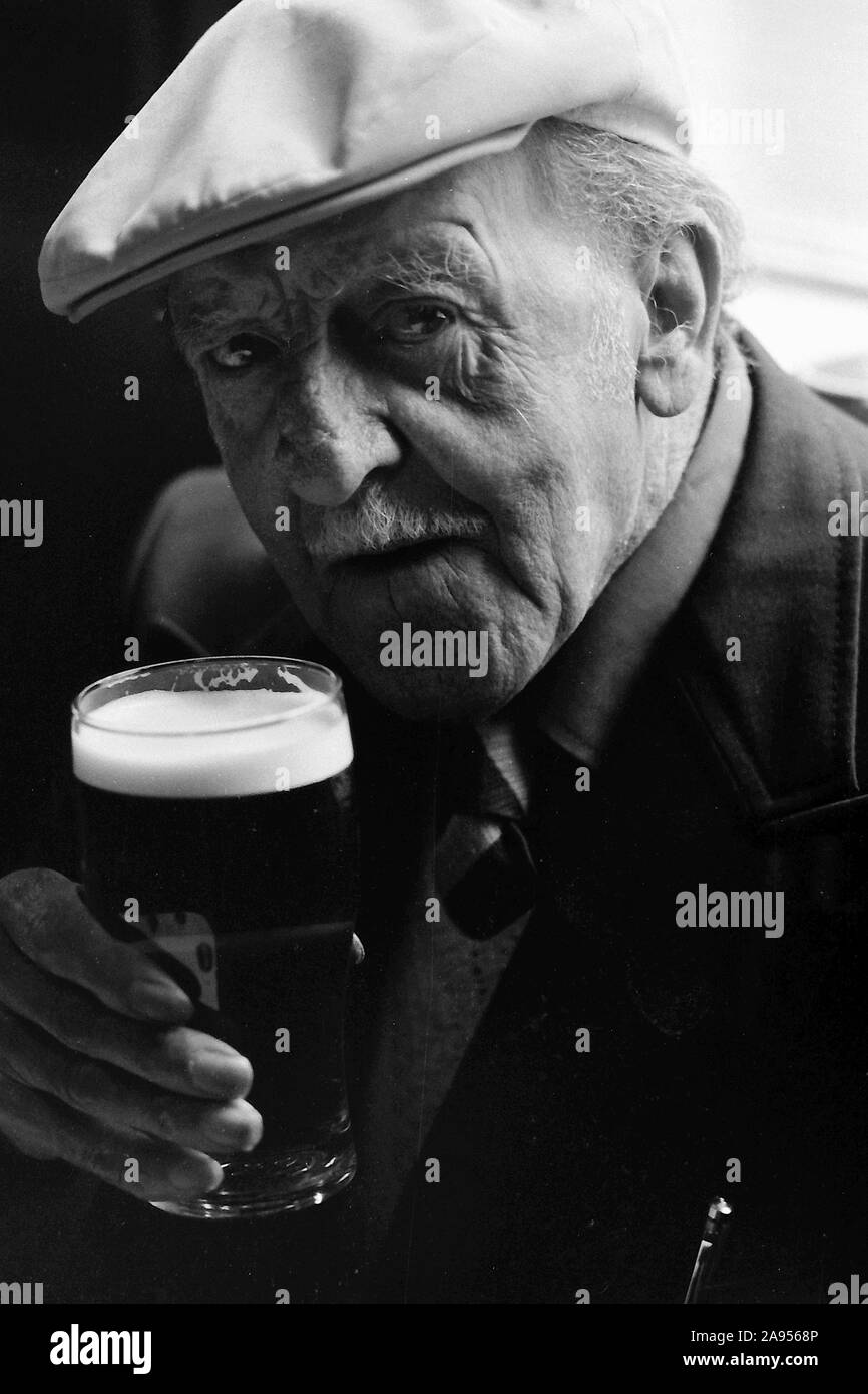 Old man and pint Stock Photo - Alamy