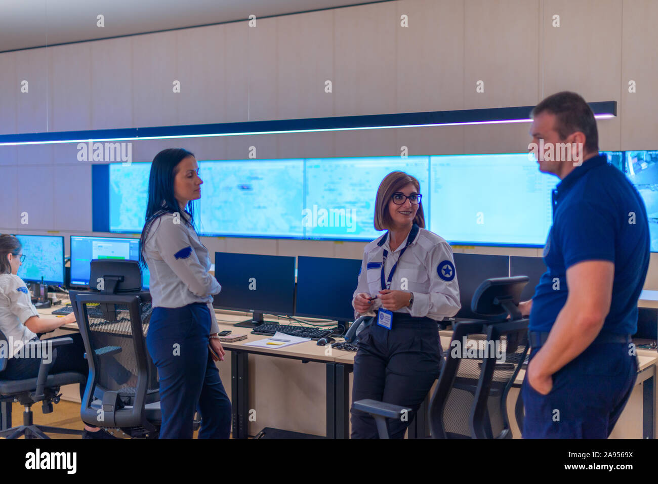 Male computer operator monitoring from a security ( computer, logistic ...