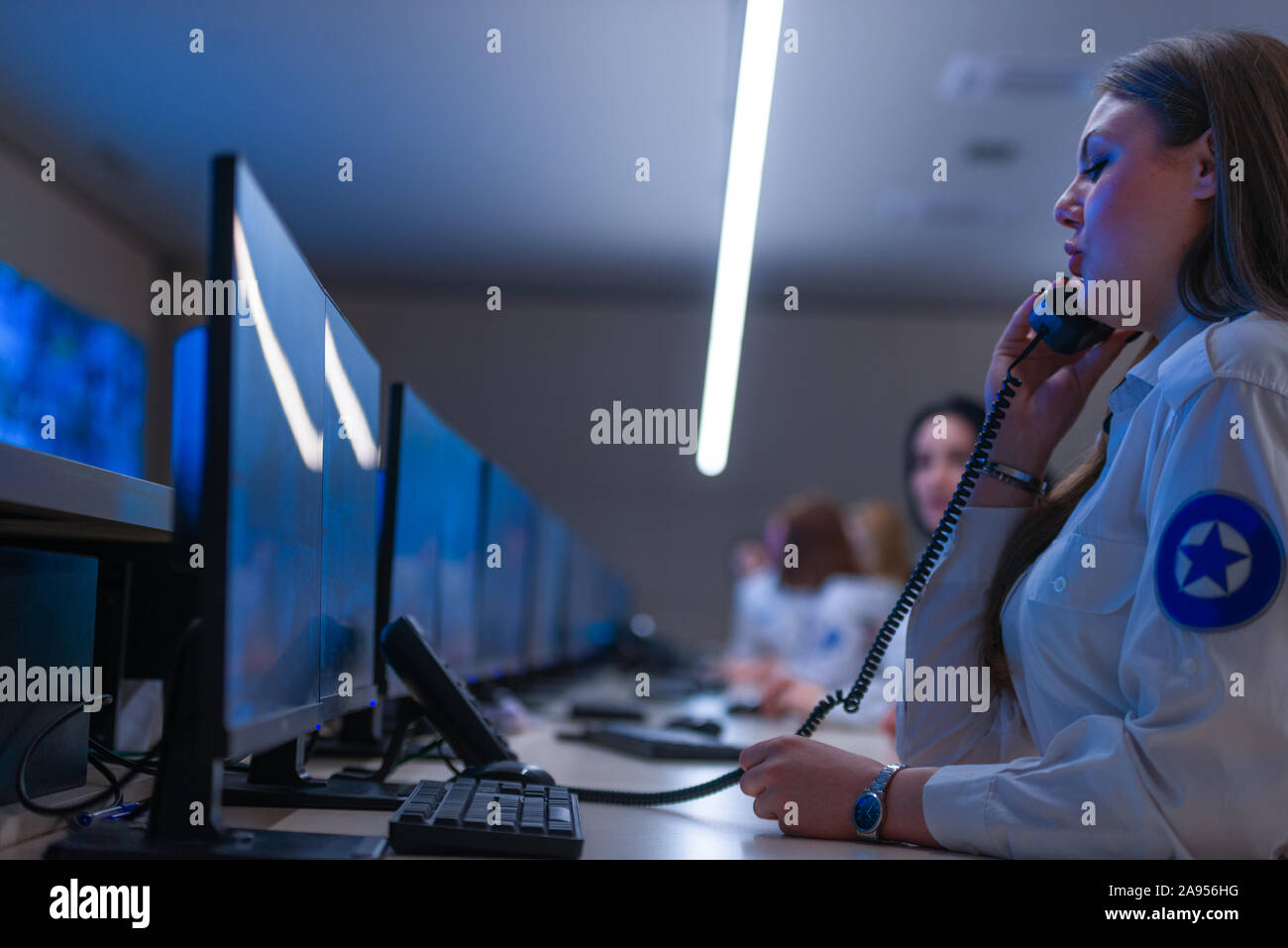 Technical Operator Works at His Workstation with Multiple Displays ...