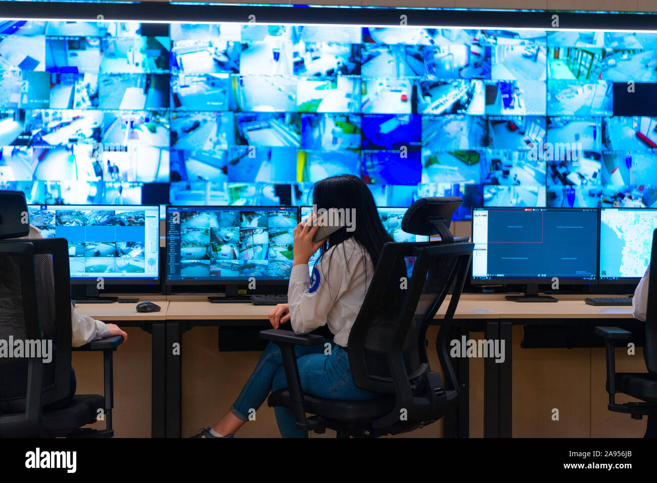 Team of secret agents in uniforms, monitoring cyber, video and ...