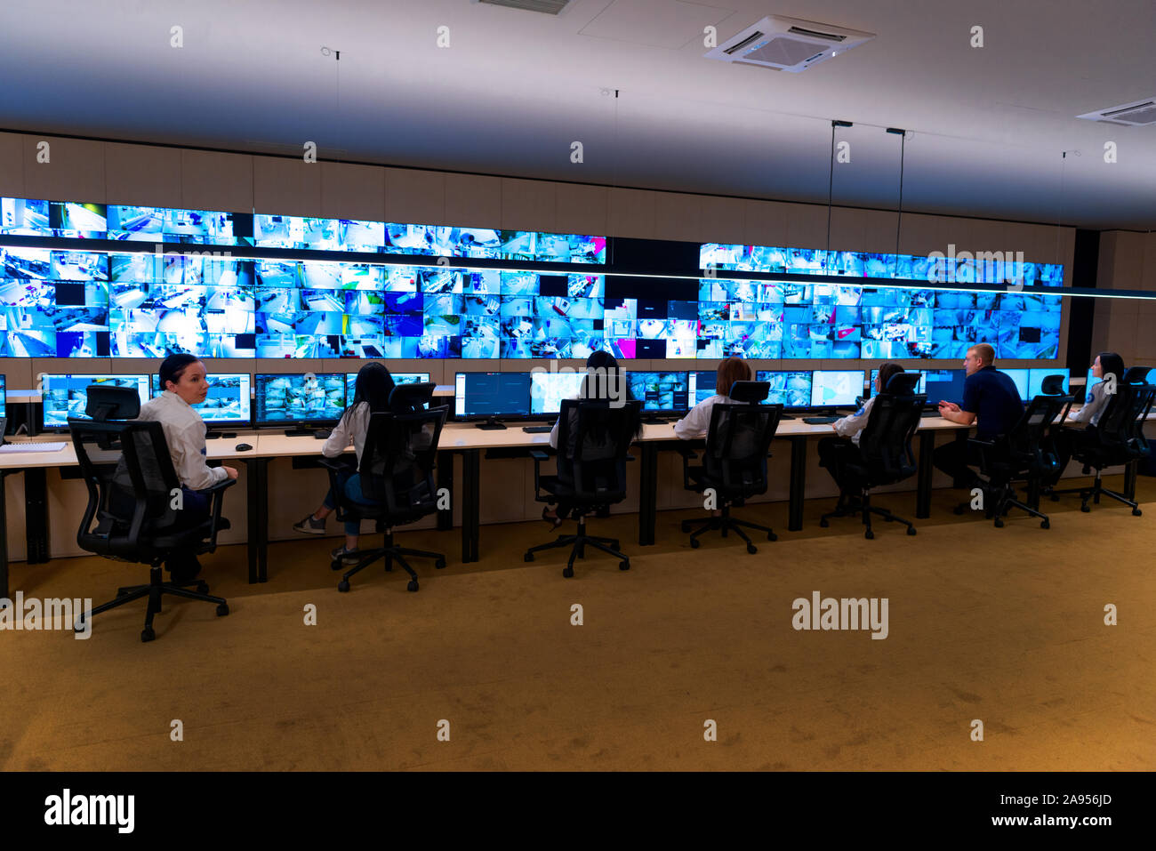 Team of secret agents in uniforms, monitoring cyber, video and ...