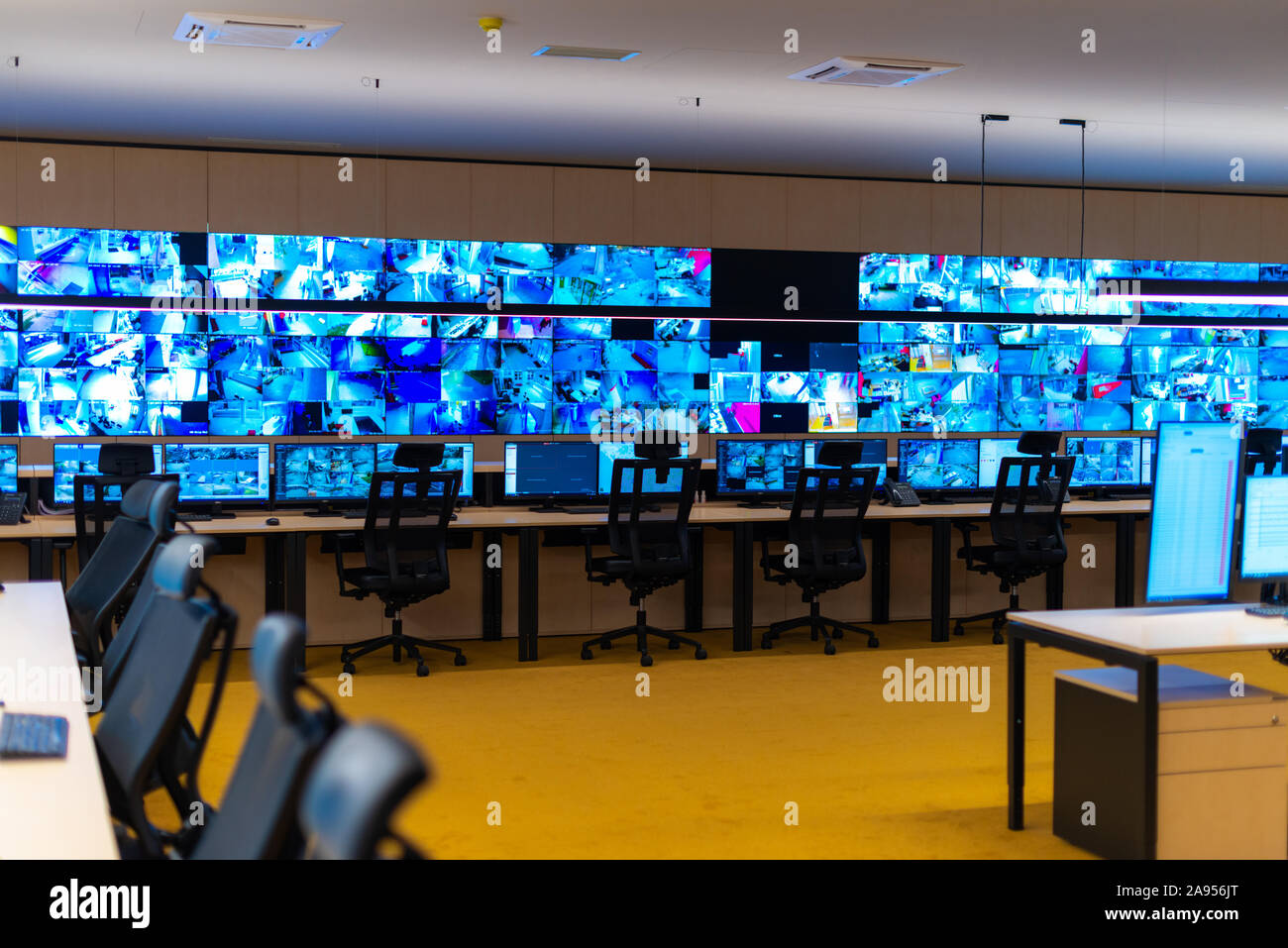 Empty office, desk, and chairs at a main CCTV security data center ...