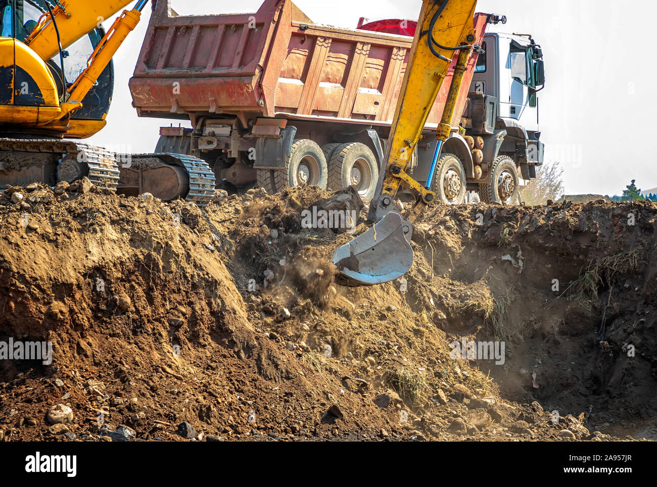 Excavator is loading excavation on the truck. Heavy construction ...