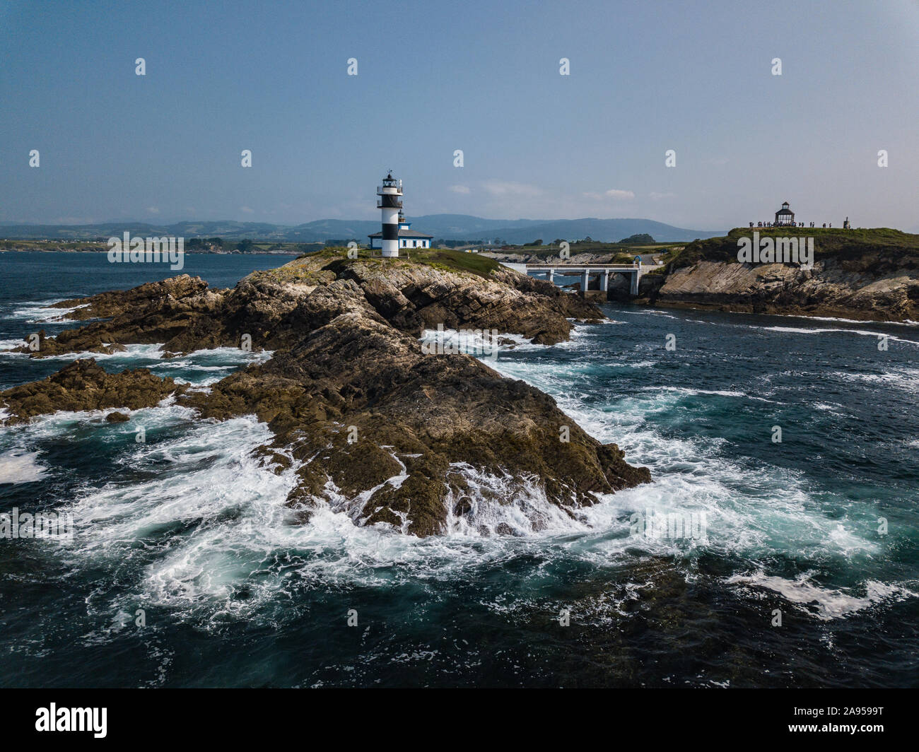 Aerial view of the lighthouse on Pancha island. Northern Spain in ...