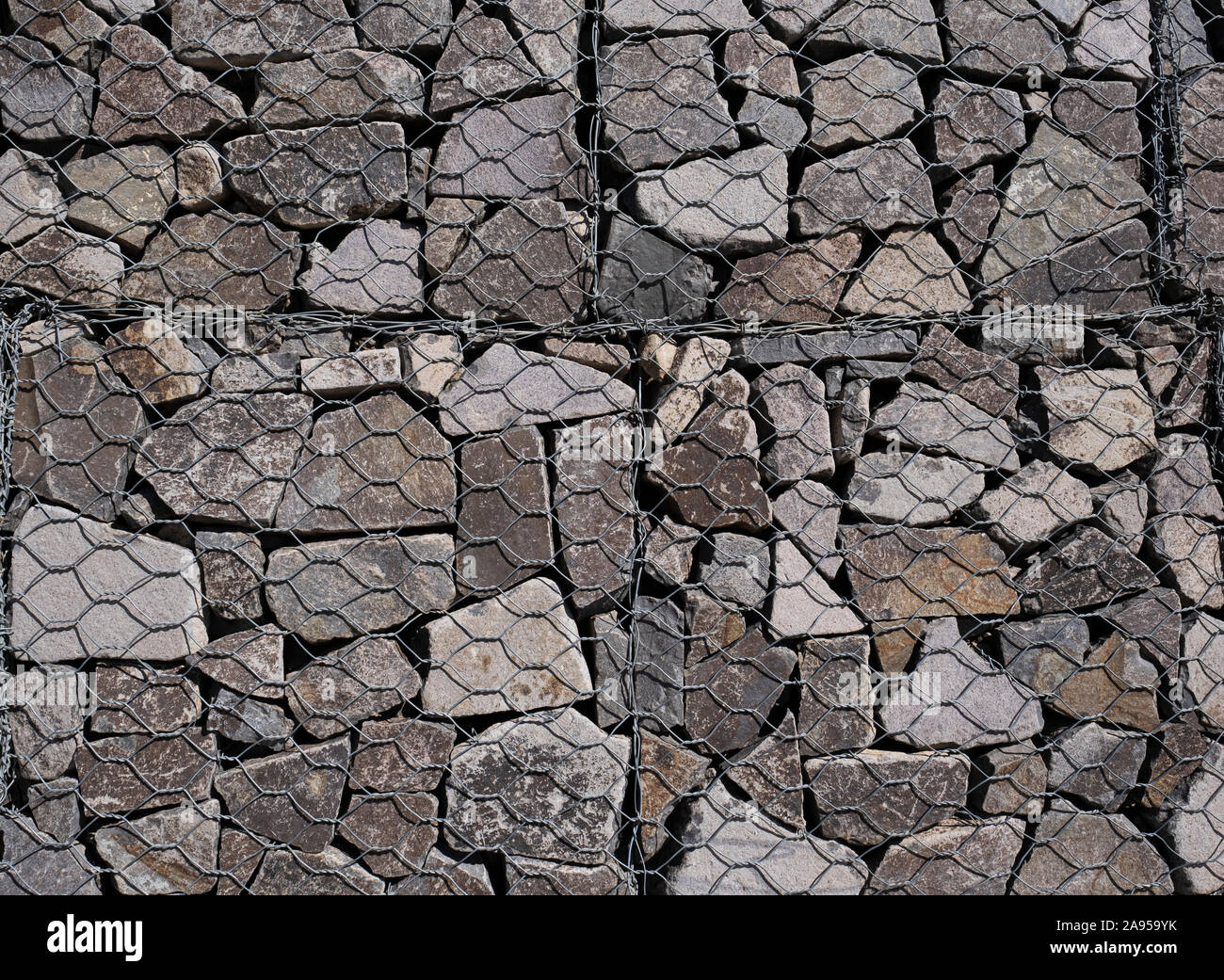 Large gabion wall detail on a sunny day Stock Photo - Alamy