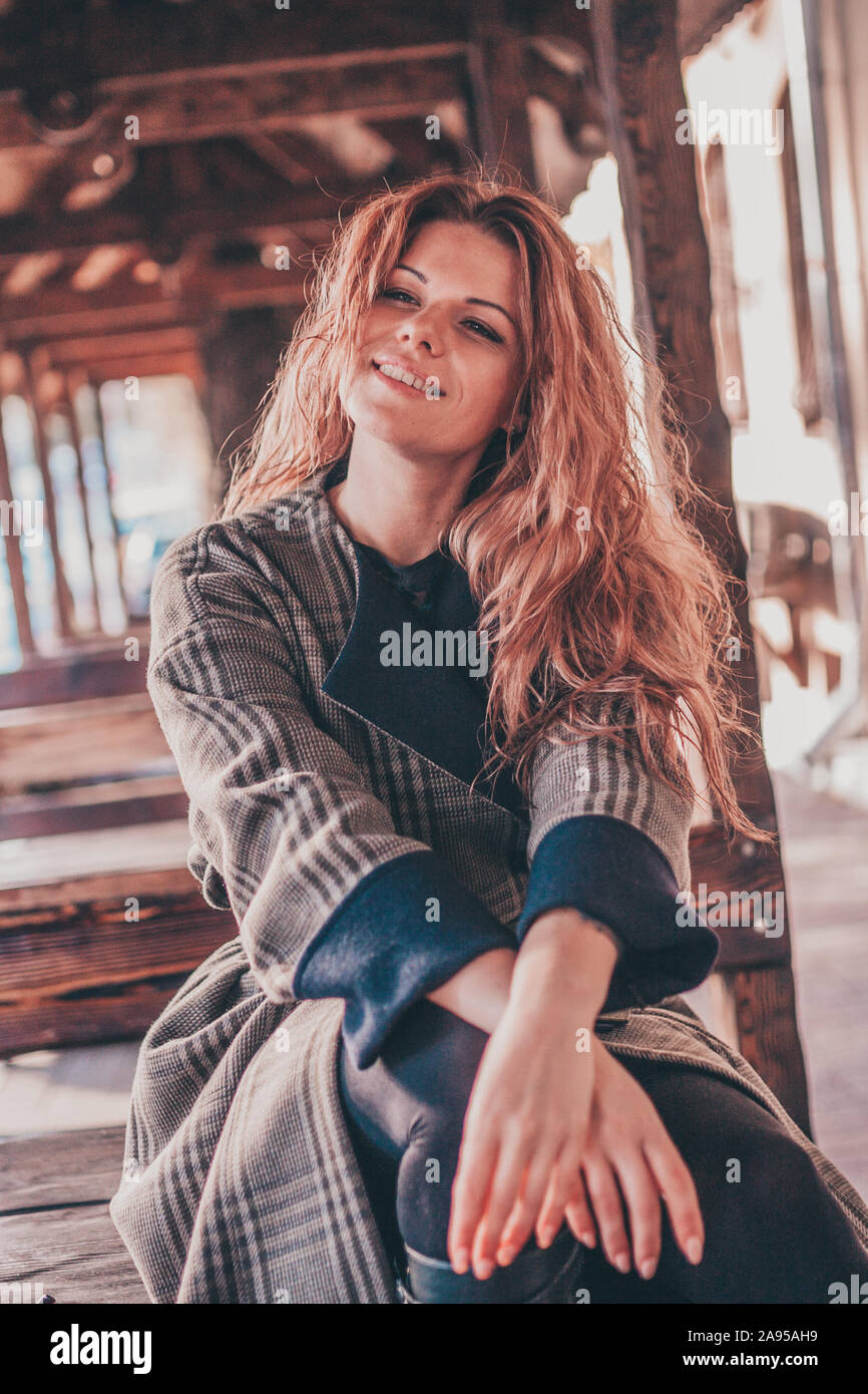 Cheerful cheerful attractive girl with luxurious hair and a charming ...