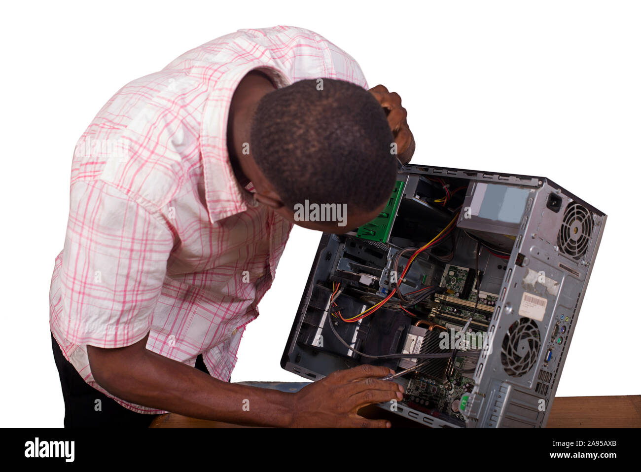 Young technician working on broken computer in his office Stock Photo ...