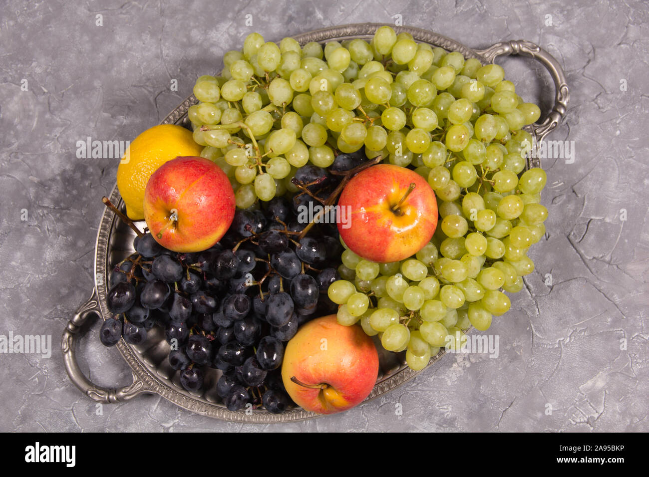 Fresh ripe fruits lie on an old tray Stock Photo - Alamy