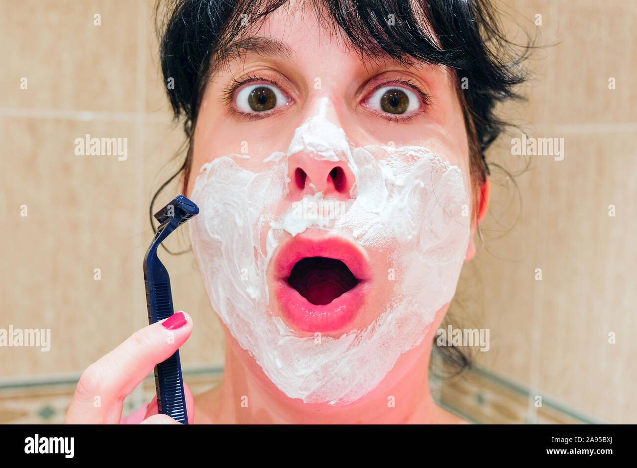 funny woman shaving her face Stock Photo - Alamy