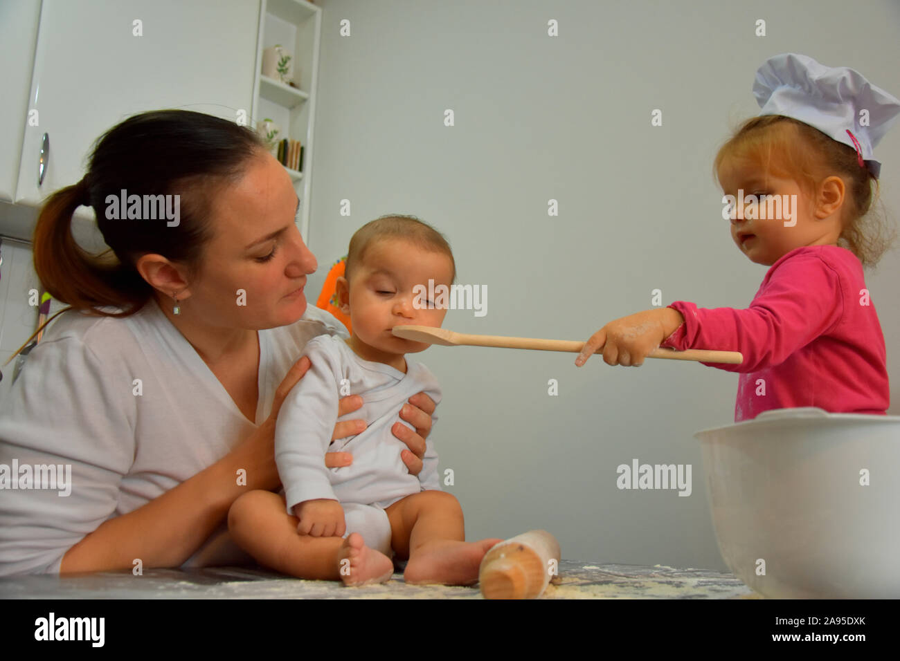 Family cooking in kitchen at home Stock Photo - Alamy