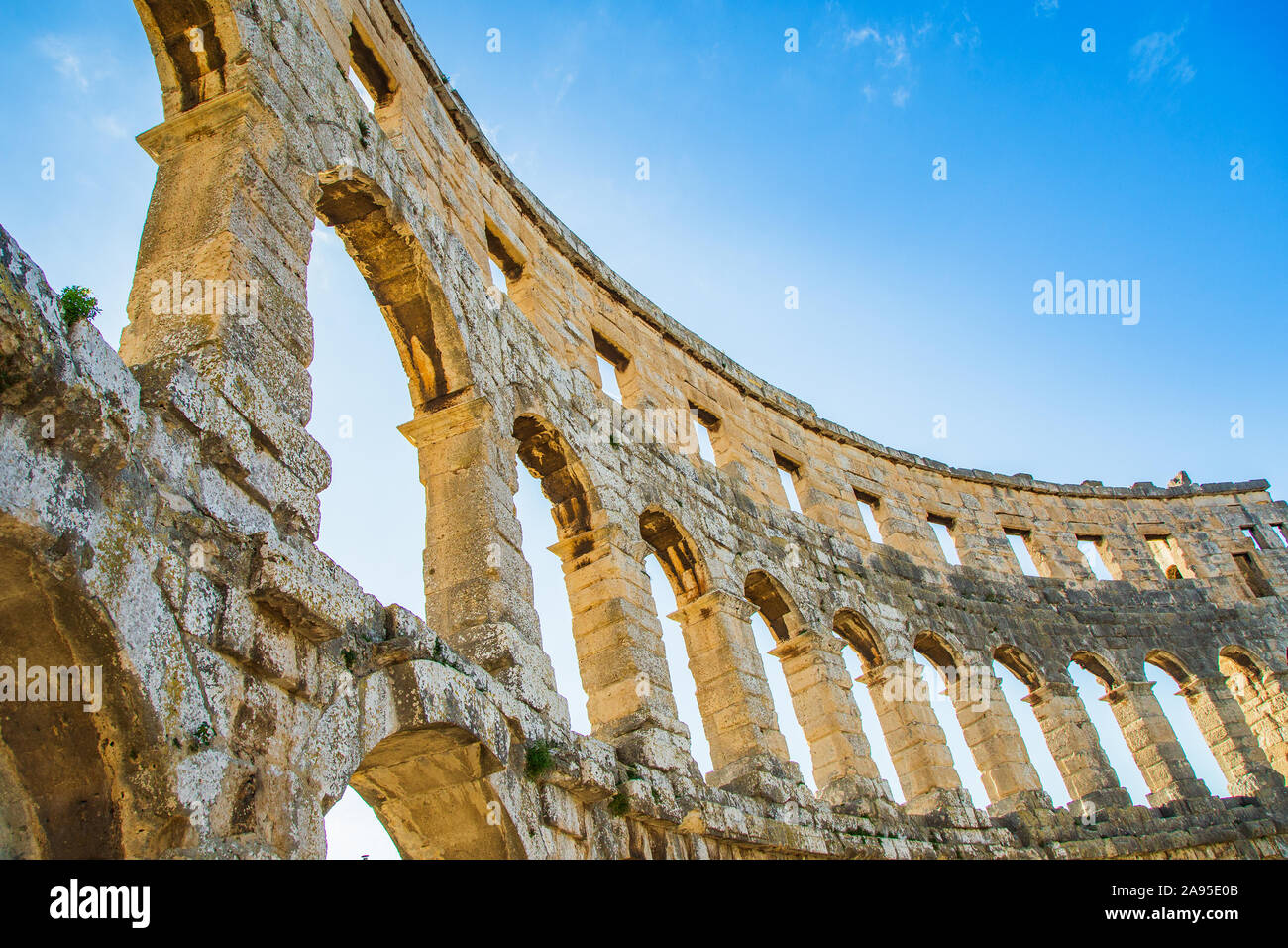 Big stone arches of monumental ancient Roman arena in Pula, Istria ...