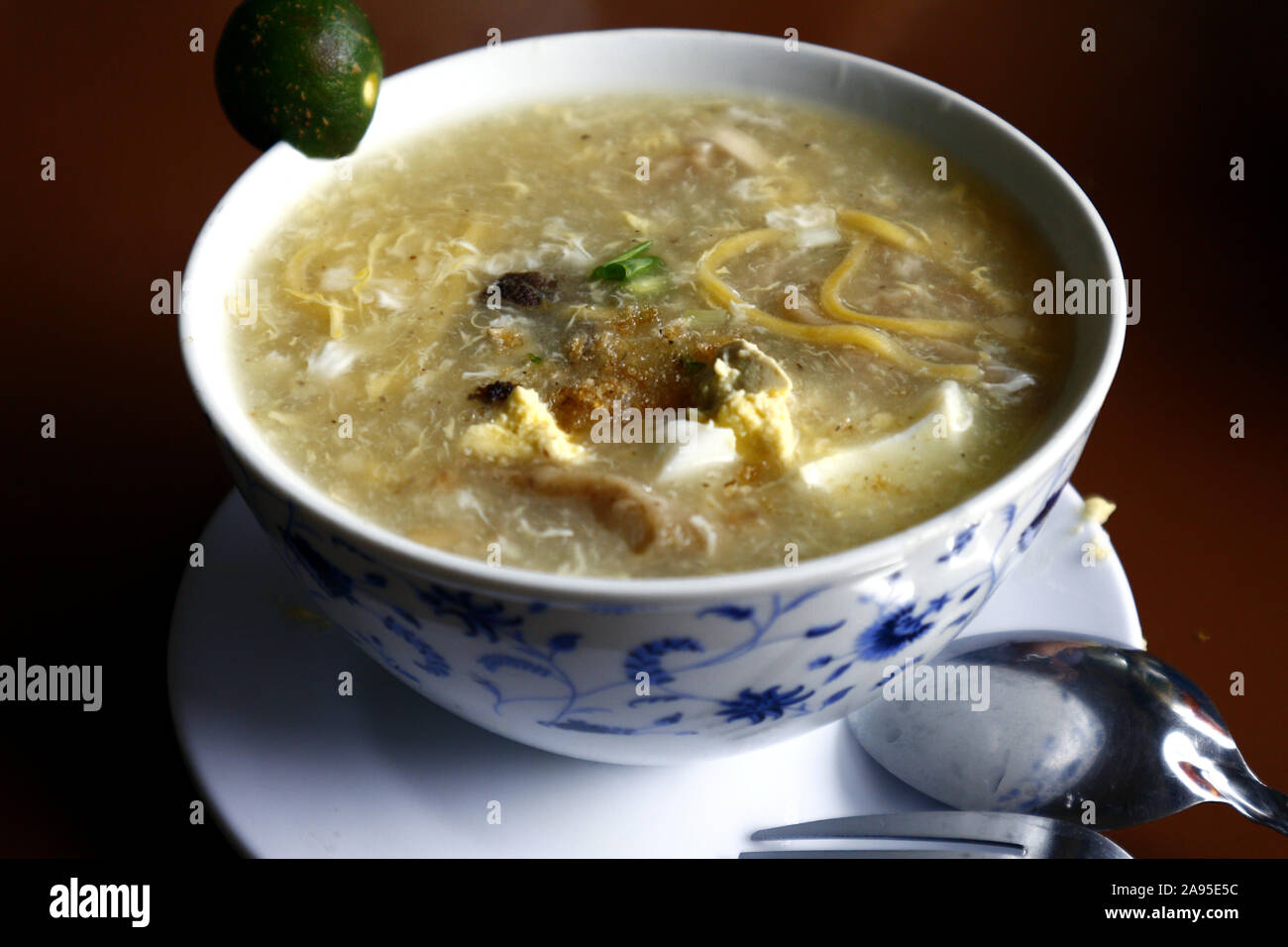 Photo of freshly cooked Lomi or fat egg noodles with pork and pork ...