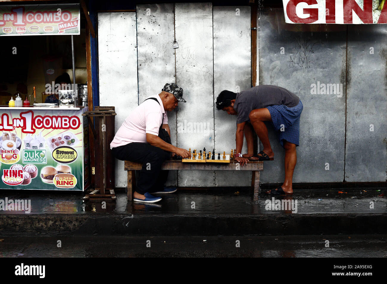 ANTIPOLO CITY, PHILIPPINES – NOVEMBER 12, 2019: Two adult Filipino men ...