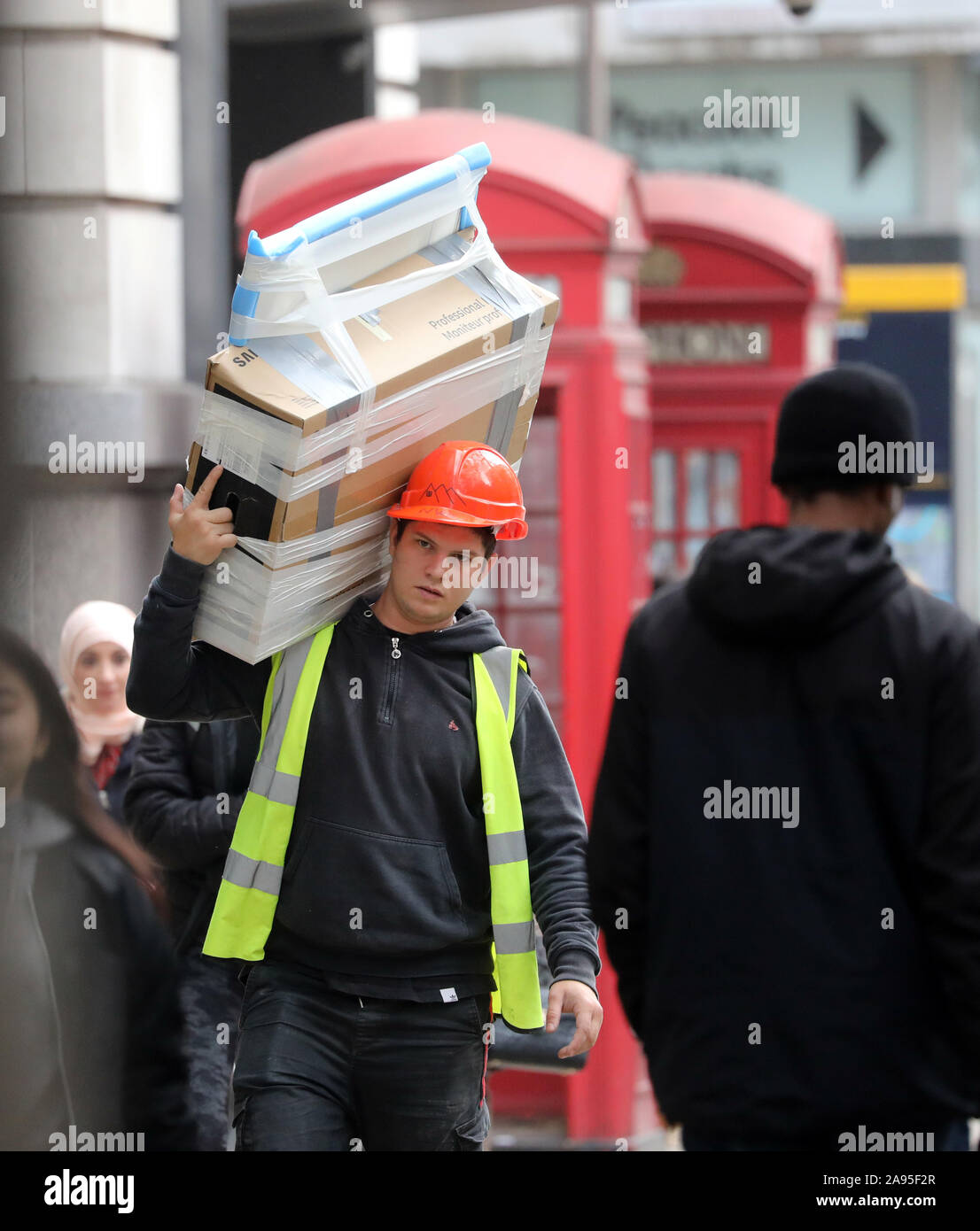 man carrying box Stock Photo - Alamy