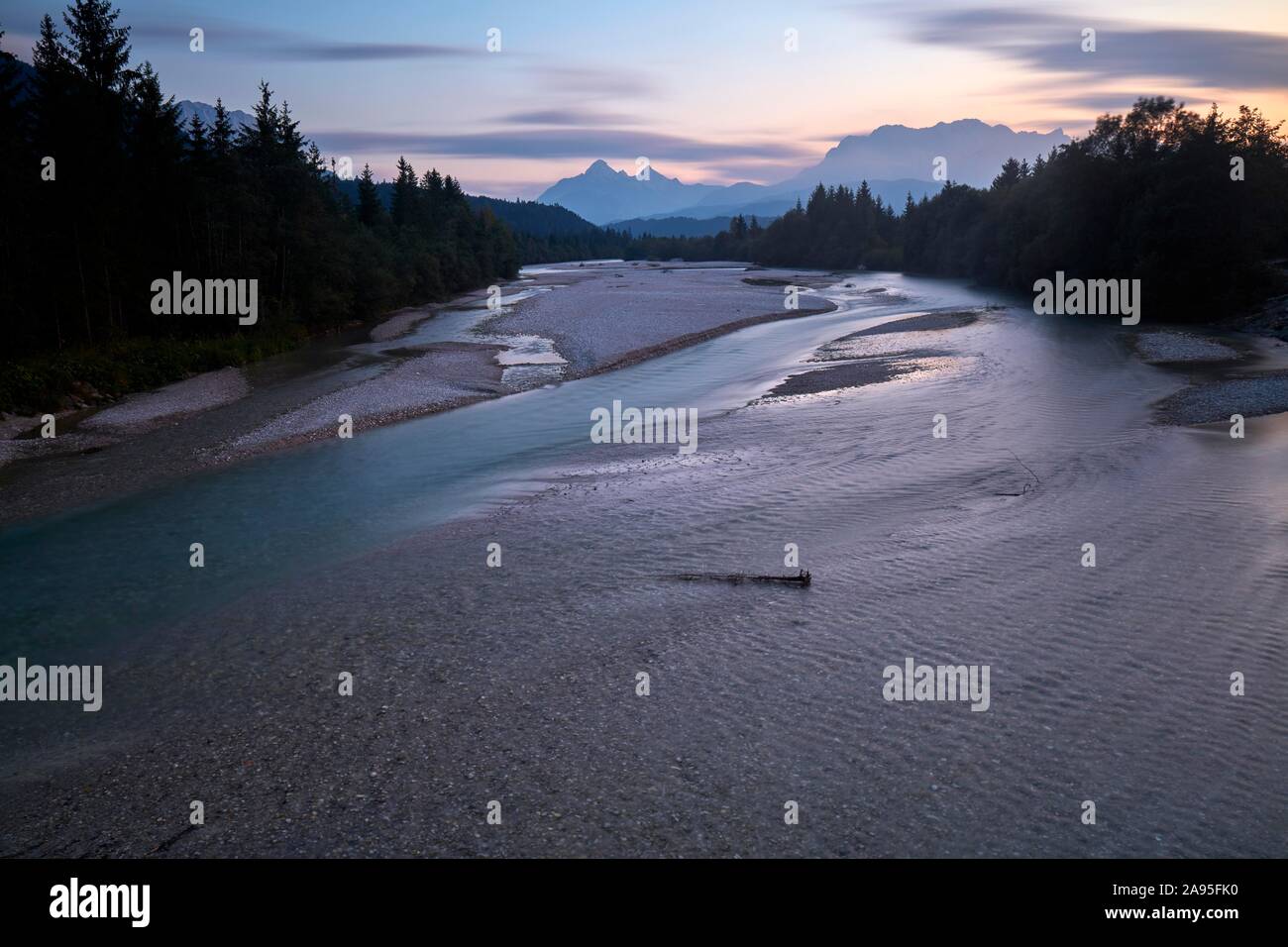View from a bridge after sunset to the wide Isar riverbed with the ...