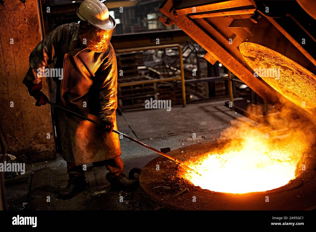 Worker on tanks with liquid iron hi-res stock photography and images ...