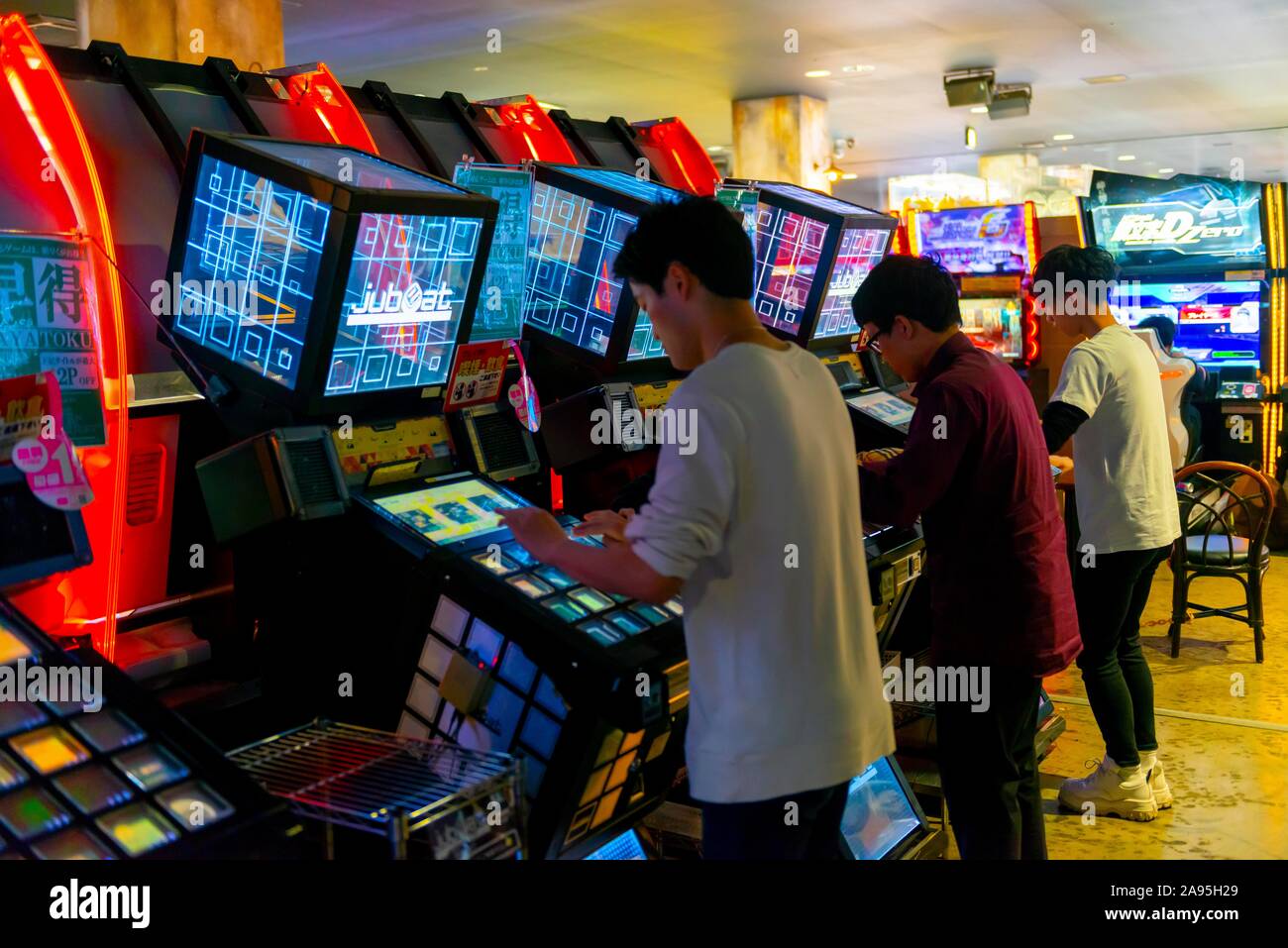 Teenagers play Jubeat, Japanese arcade game, Anata no Warehouse arcade ...