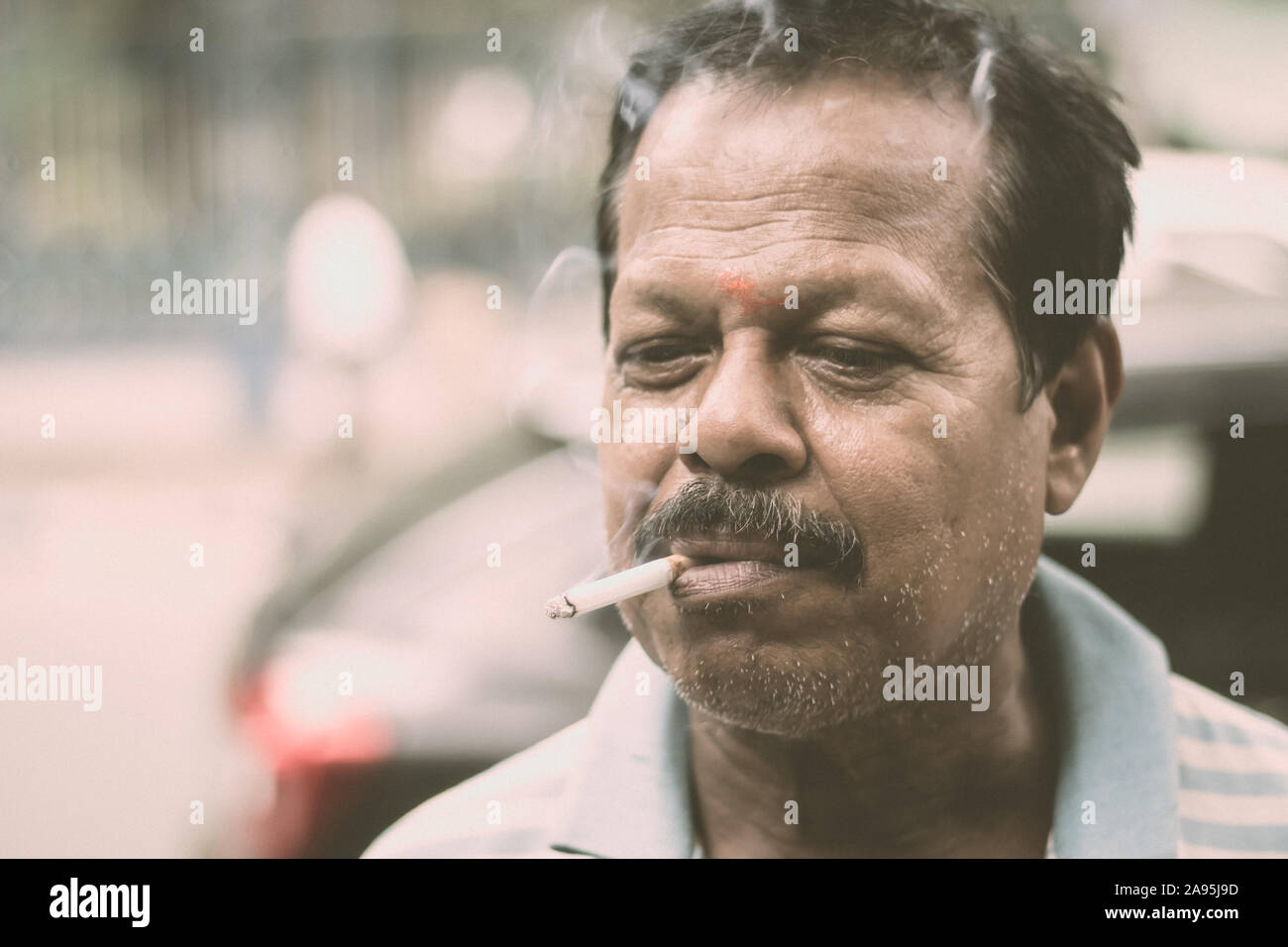 Portrait of a A mid adult senior mature man of Asian and Indian ...