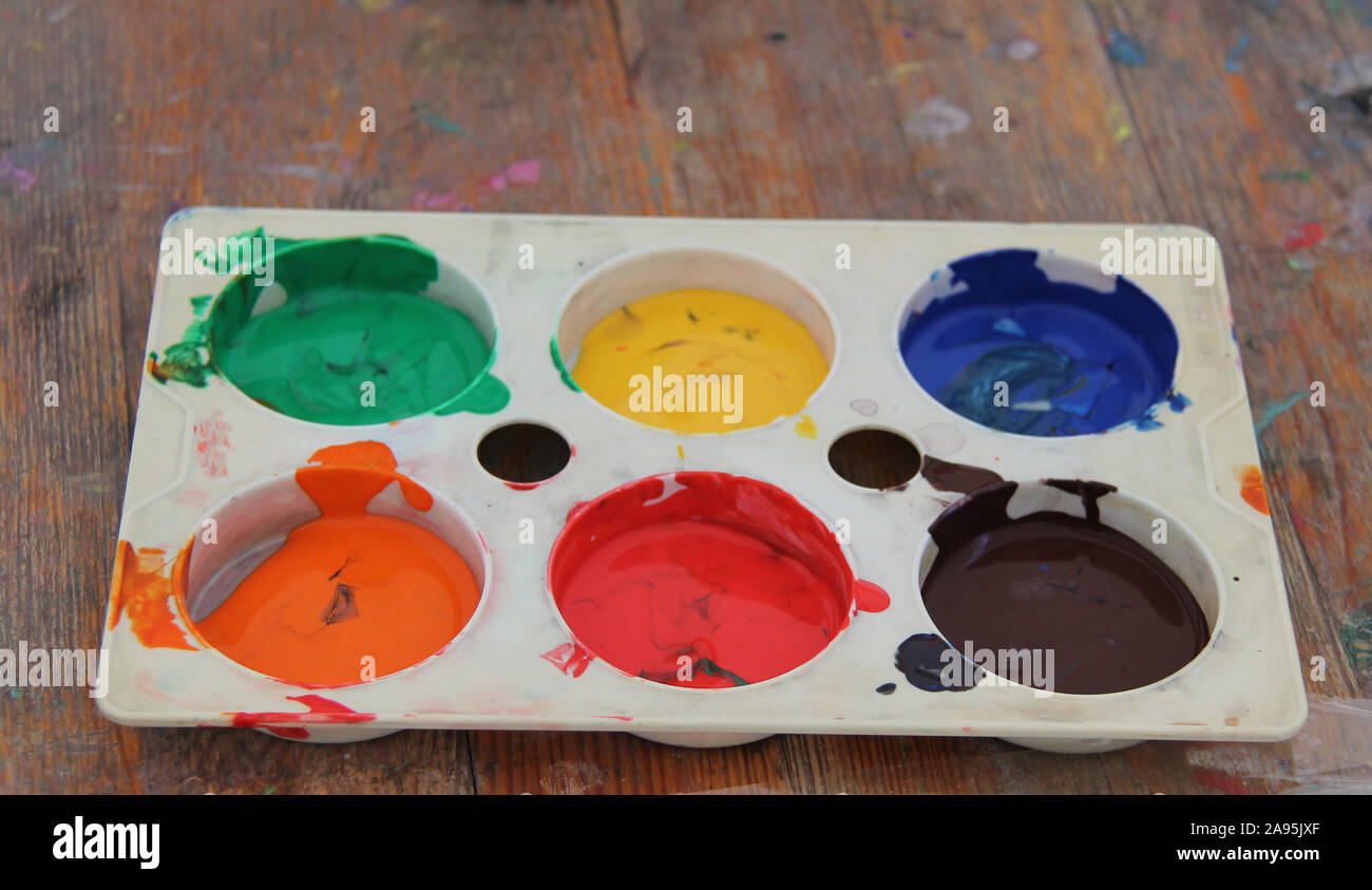 The Colour Paint Pots of a Painting Artist Stock Photo - Alamy