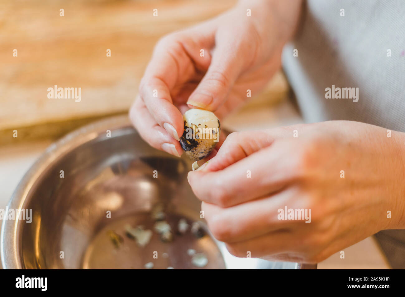 The hard work of cleaning quail eggs from the shell Stock Photo - Alamy