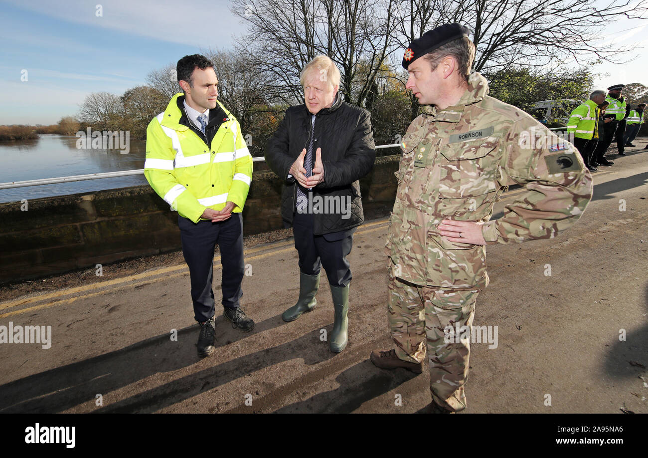 Prime Minister Boris Johnson walks with Lt Col Tom Robinson from the ...