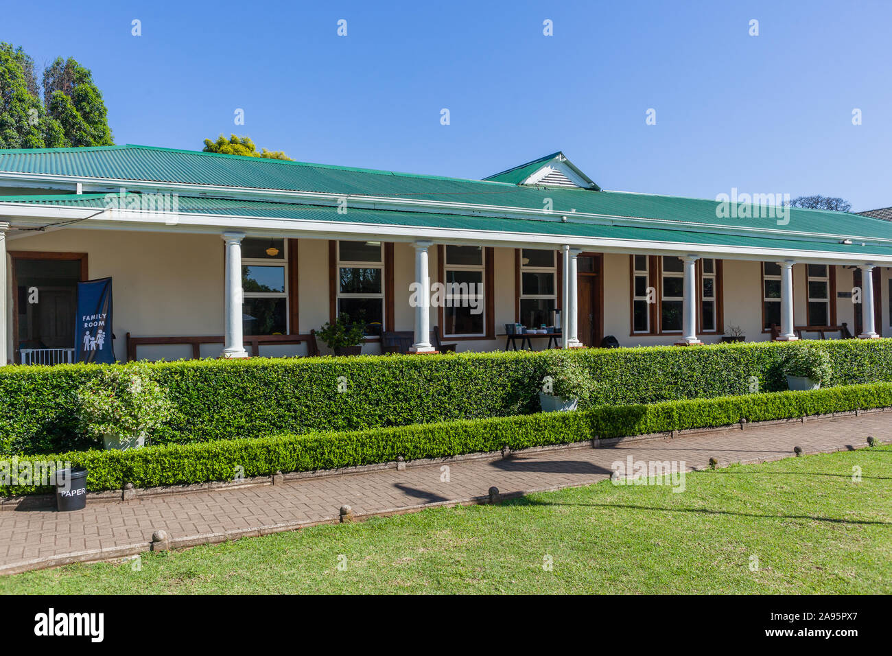 Ground level building with education classrooms offices with porch ...