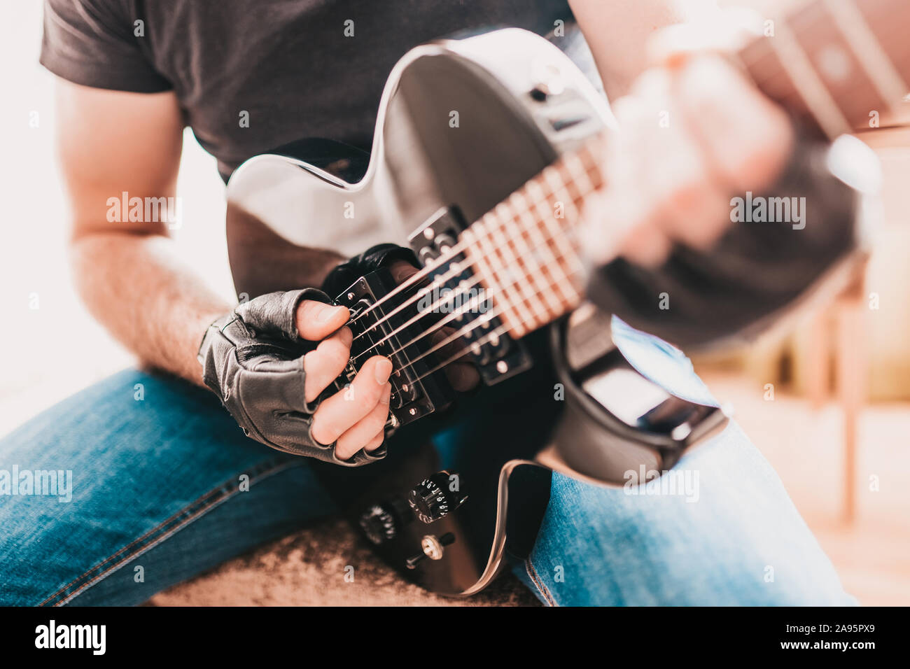 Rocker play heavy metal on electric guitar Stock Photo - Alamy