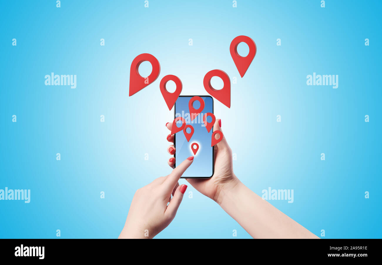 A Female is clicking on an app icon at her smart phone and lots of ...