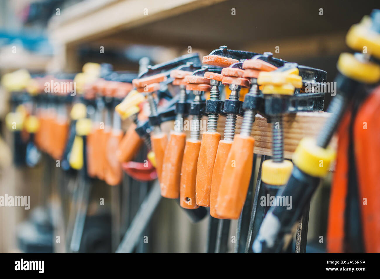 Carpentry workshop - a professional tool - a large set of clamps Stock ...