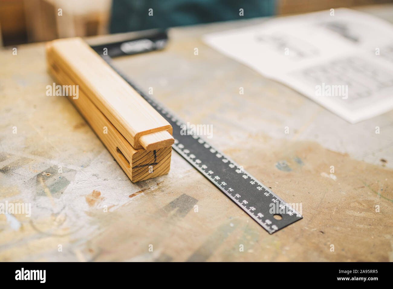 Carpentry workshop - wooden parts and a square on the workbench Stock ...