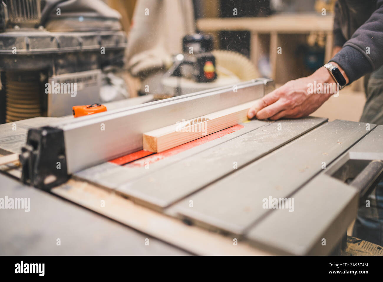 Carpentry workshop - a professional worker at the sawmill Stock Photo ...