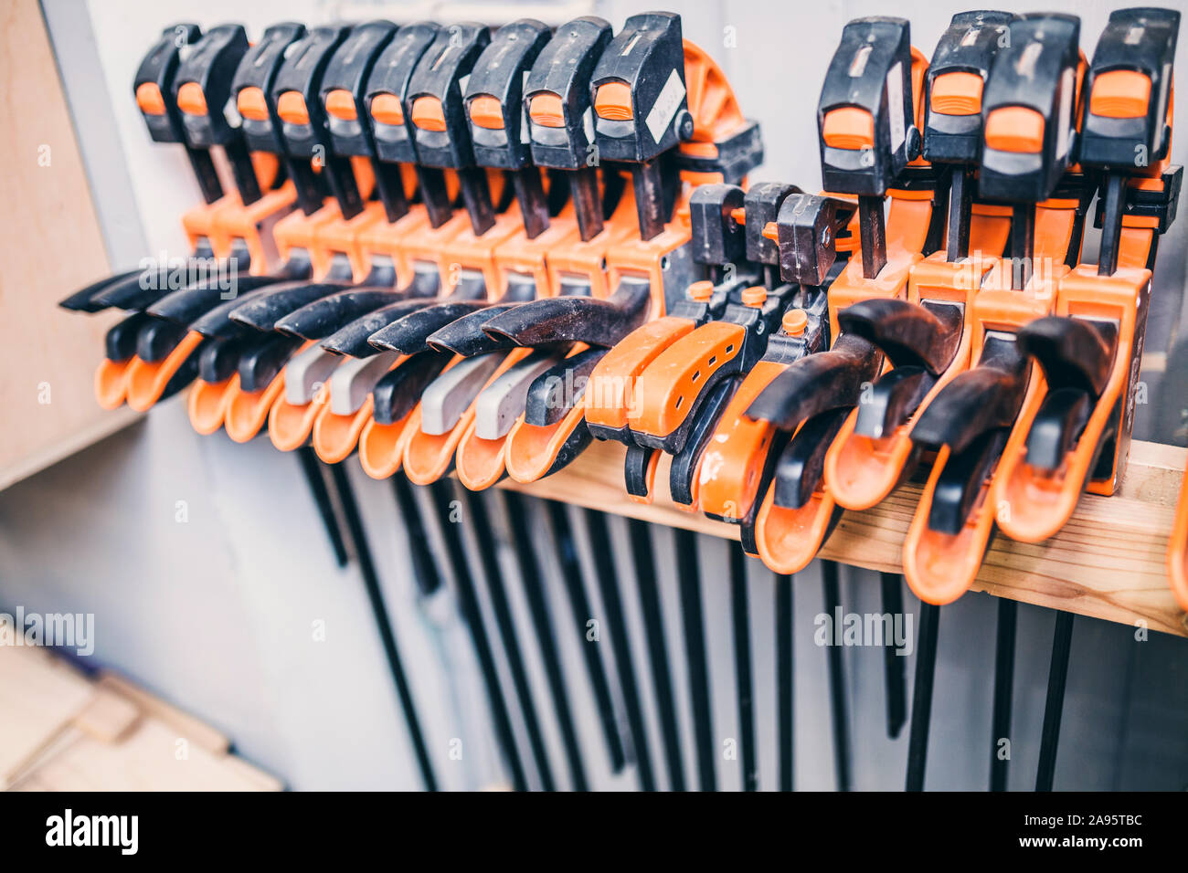 Carpentry workshop - a large set of clamps - a professional tool Stock ...