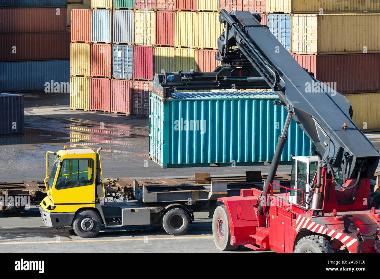 Stack of containers with truck and forklift Stock Photo - Alamy