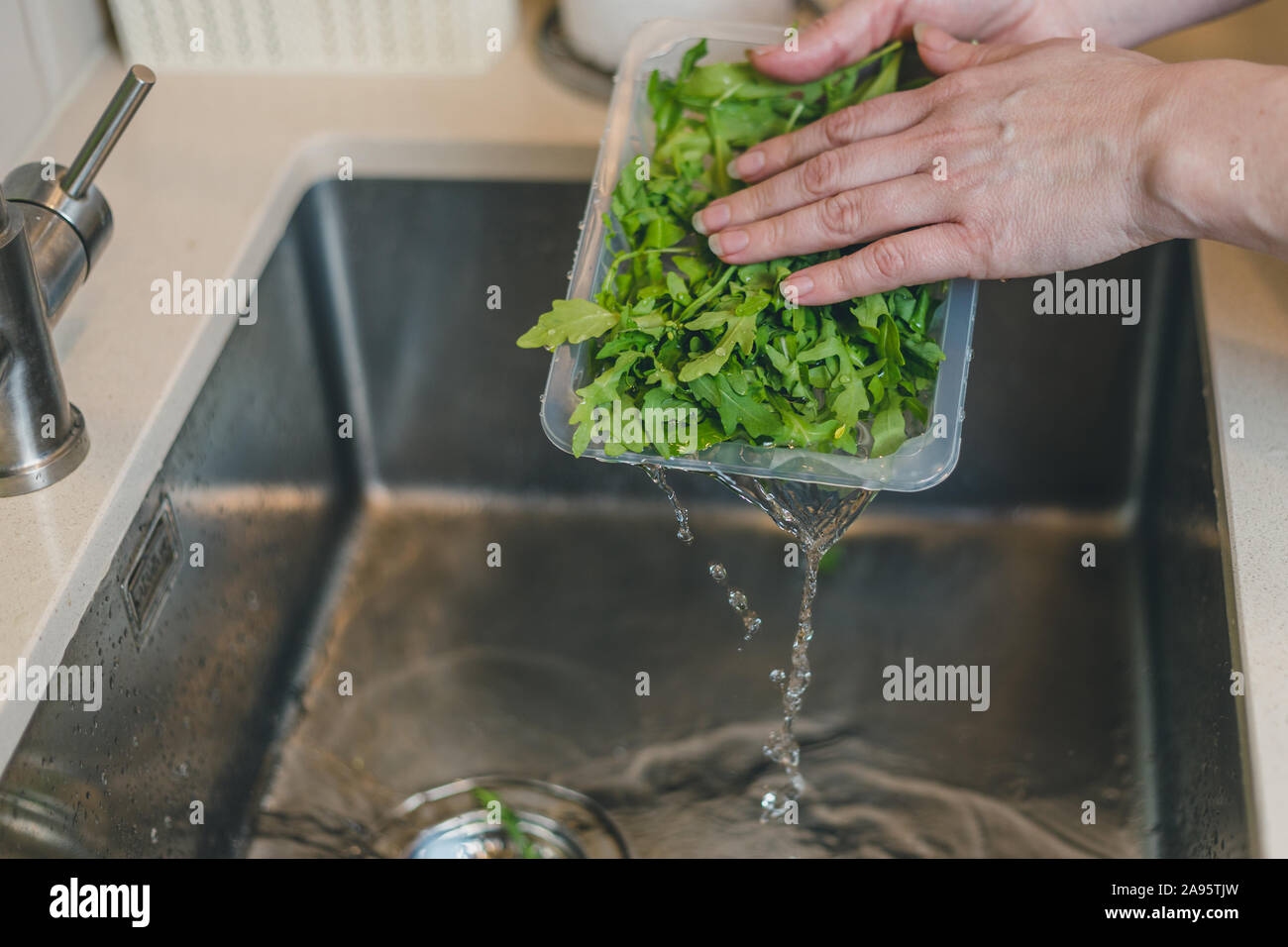Healthy eating cooking woman wash hi-res stock photography and images ...