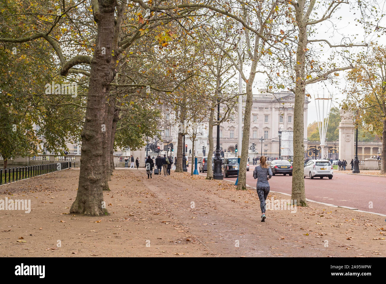 Female jogger, rear view, running on the pavement of The Mall in ...