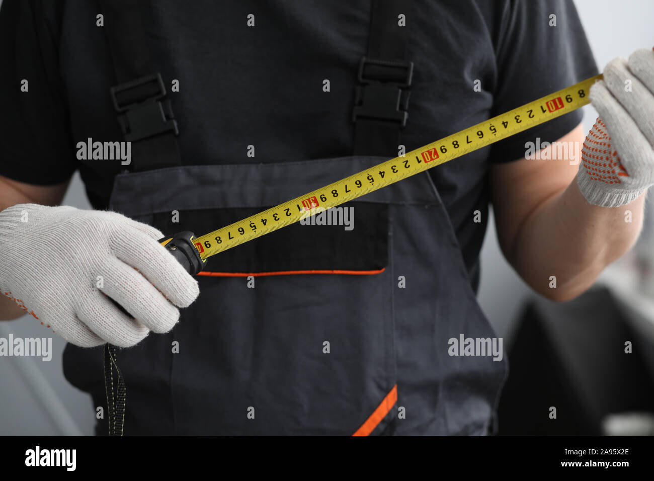 Construction engineer holding ruler scale hi-res stock photography and ...