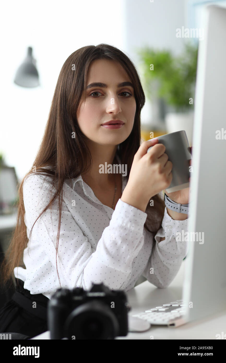 Cute lady enjoying cup of tea Stock Photo - Alamy