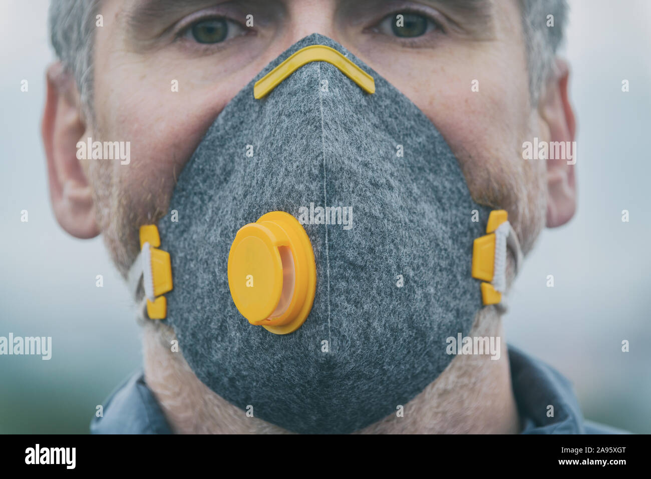 man wearing a real anti-pollution, anti-smog and viruses face mask ...