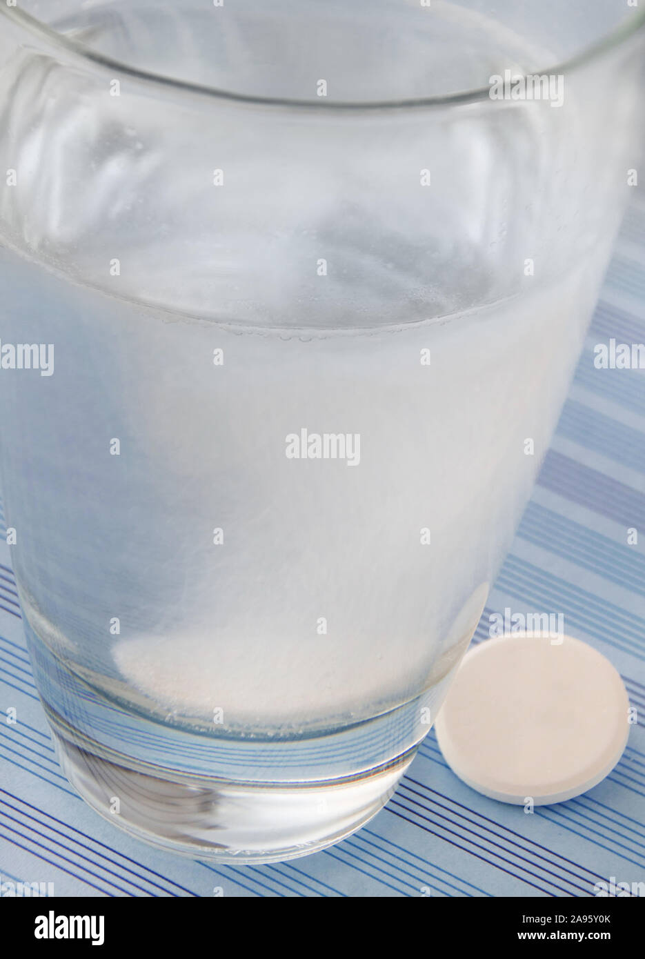 Tablet and a glass of water Stock Photo - Alamy