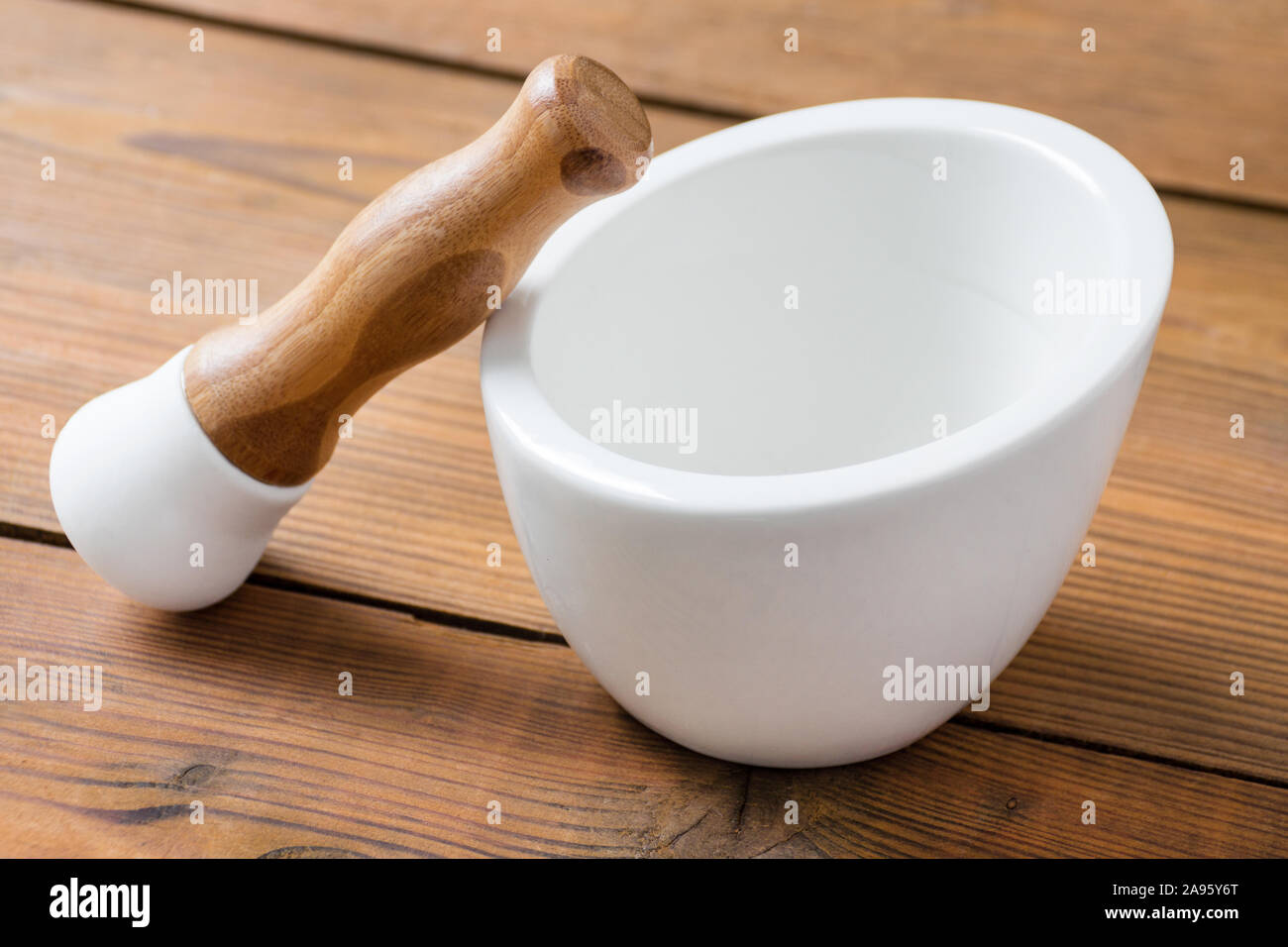 Mortar and wooden tabke Stock Photo - Alamy