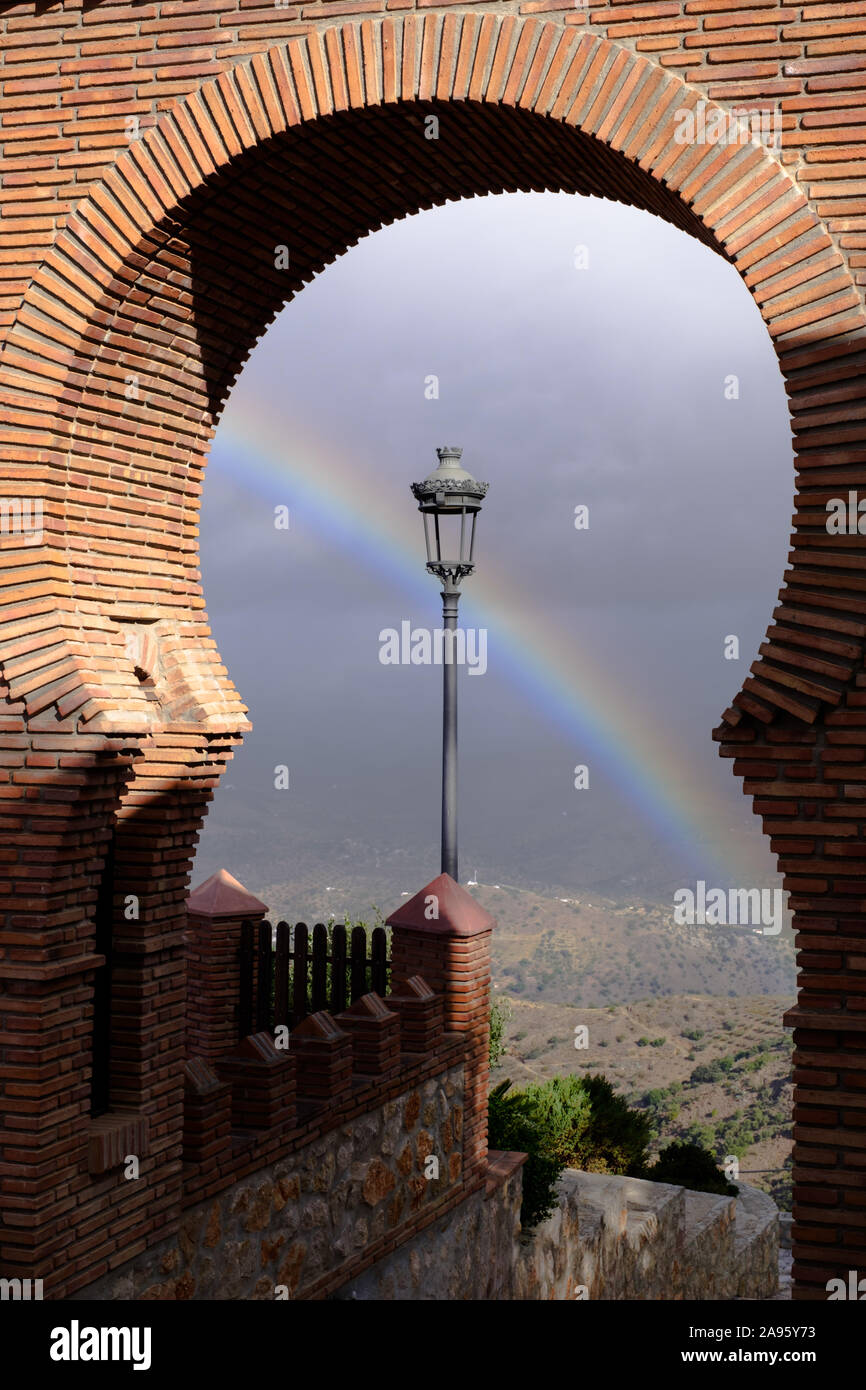 Rainbow viewed from the mountain top white village of Comares, Malaga ...