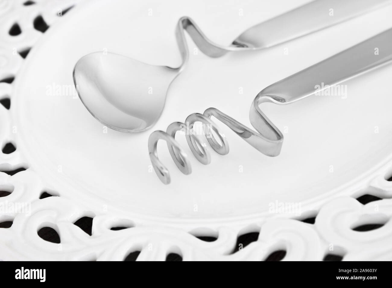 Honey spoon and dipper against white background Stock Photo - Alamy