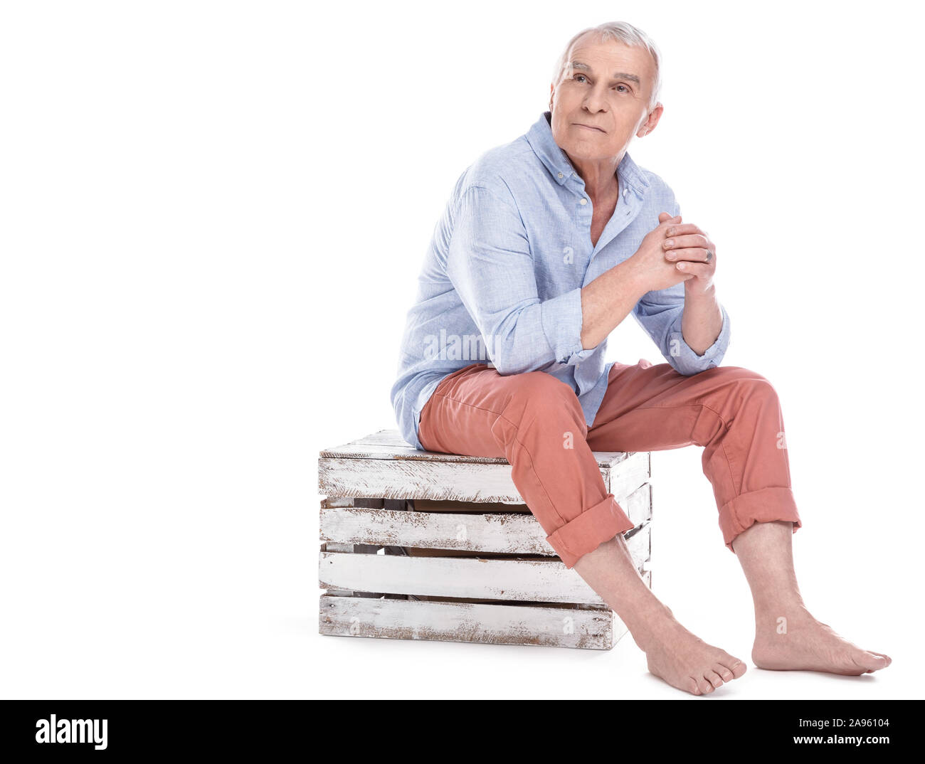 Man sitting on box hi-res stock photography and images - Alamy