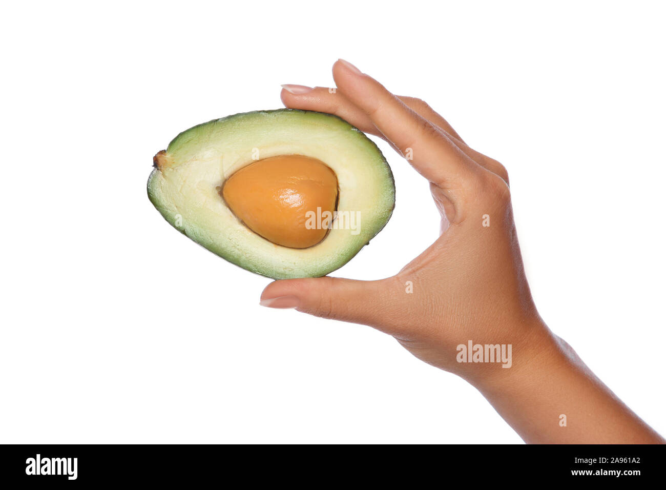 Female hand with fresh avocado fruit on white background Stock Photo ...